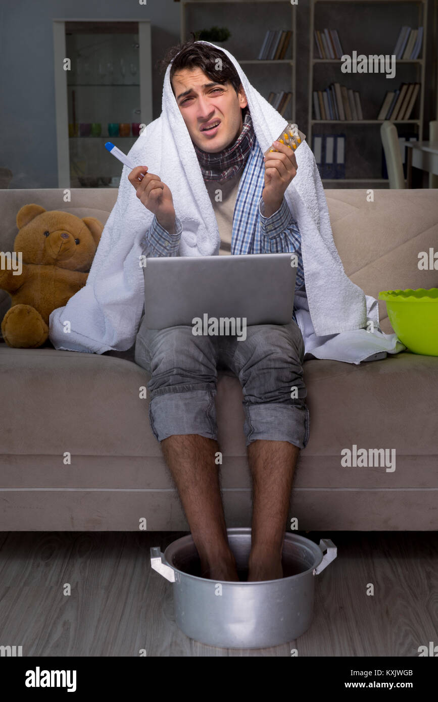 Sick man washing his feet at home Stock Photo - Alamy