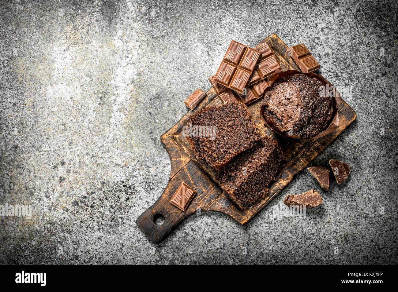 Chocolate fresh muffins. On a rustic background Stock Photo - Alamy