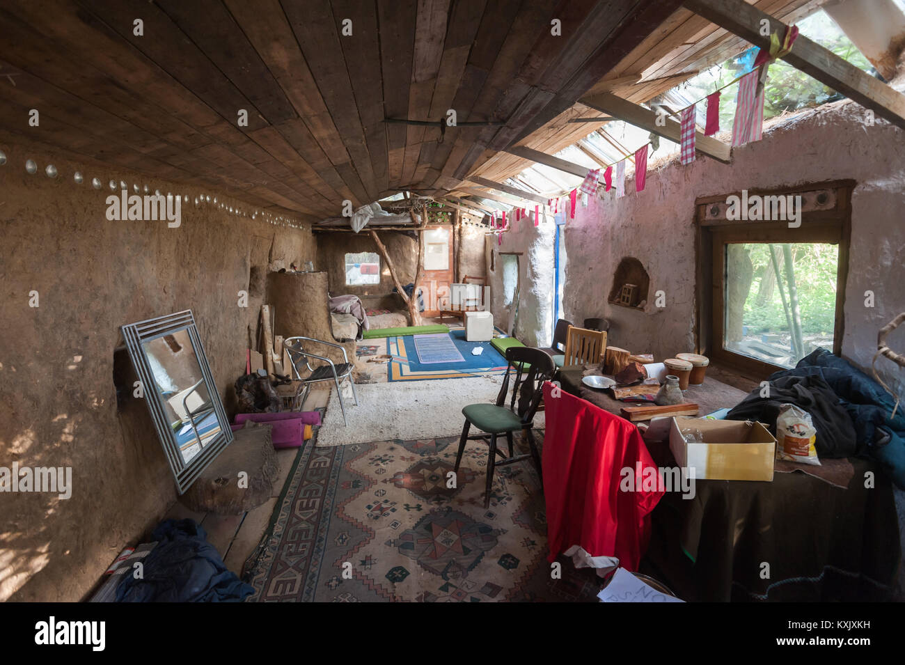 The spacious interior of Strawbale House showing its cob (straw + mud ...
