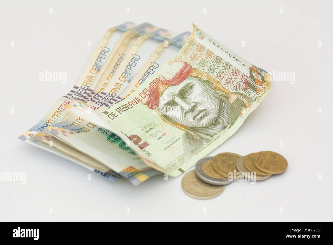 Notes and coins in the Peruvian currency, the Sol Stock Photo - Alamy