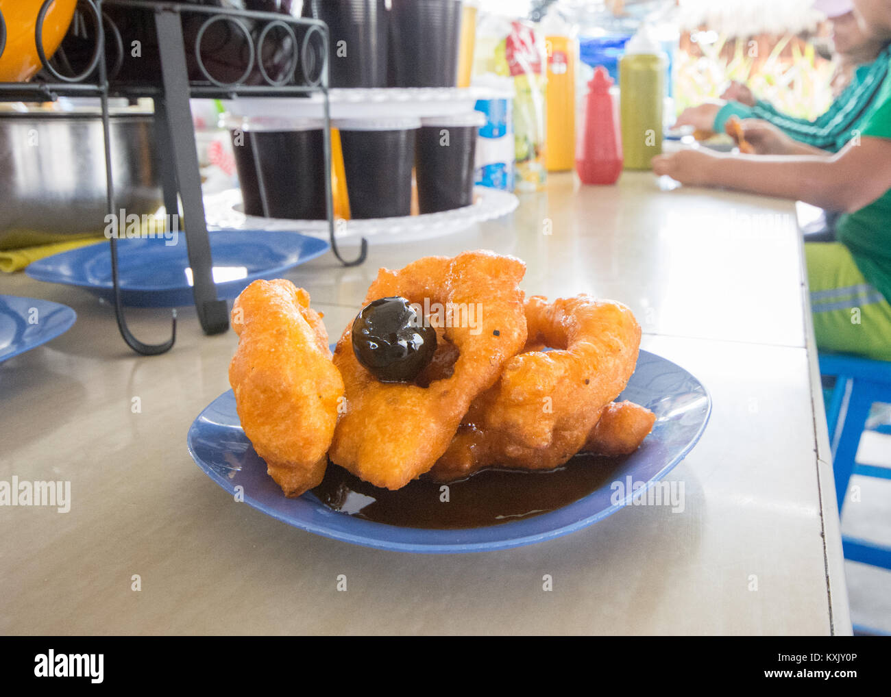 The typical Peruvian treat of Picarrones covered in Fig syrup with a ...