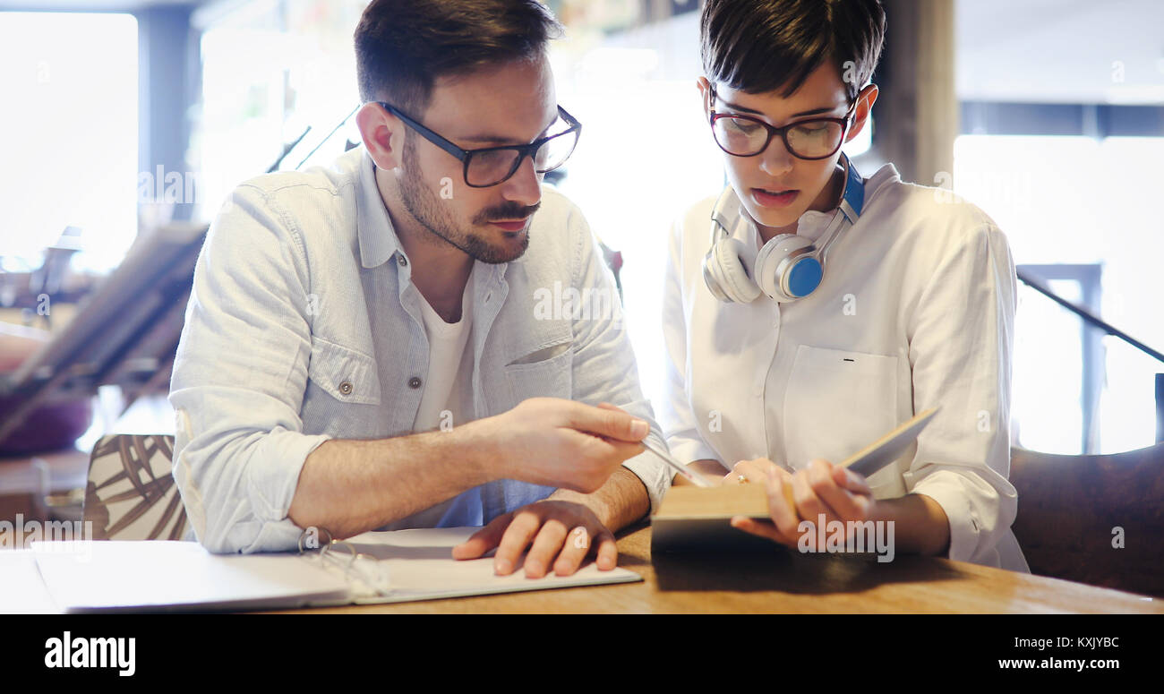 Students couple in school studying for exams together Stock Photo - Alamy