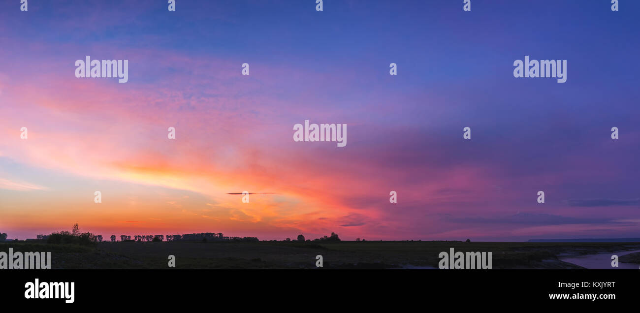 Natural Sunset Sunrise Over Field Or Meadow. Bright Dramatic Sky And ...