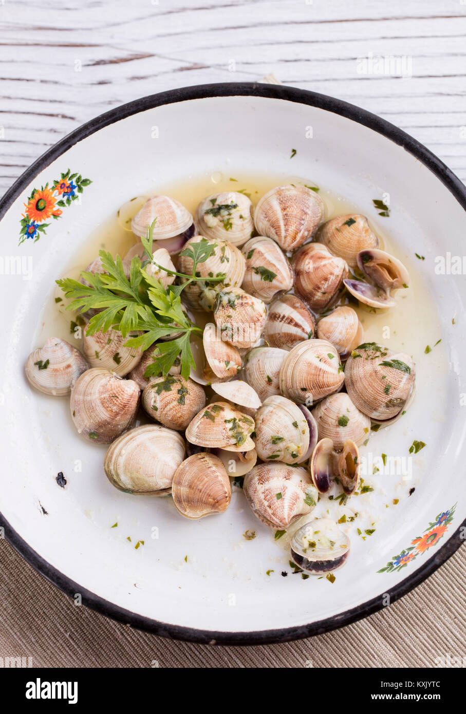 clams in very old plate with green parsley Stock Photo - Alamy