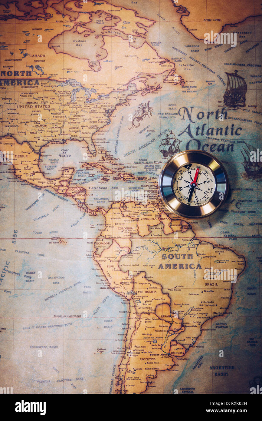 Columbus day and world map with compass Stock Photo - Alamy