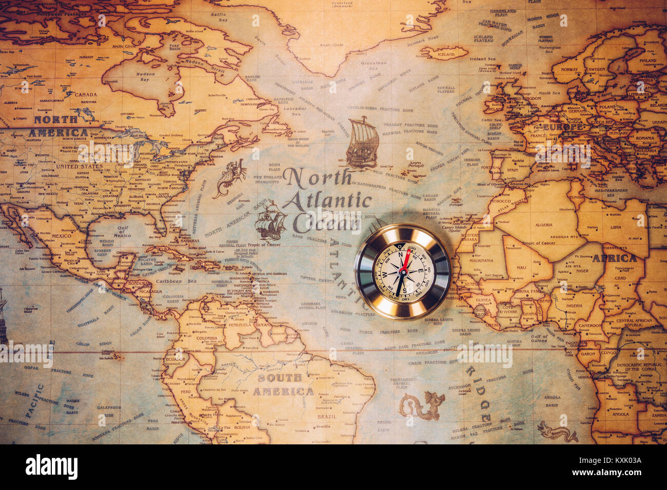 Columbus day and world map with compass Stock Photo - Alamy