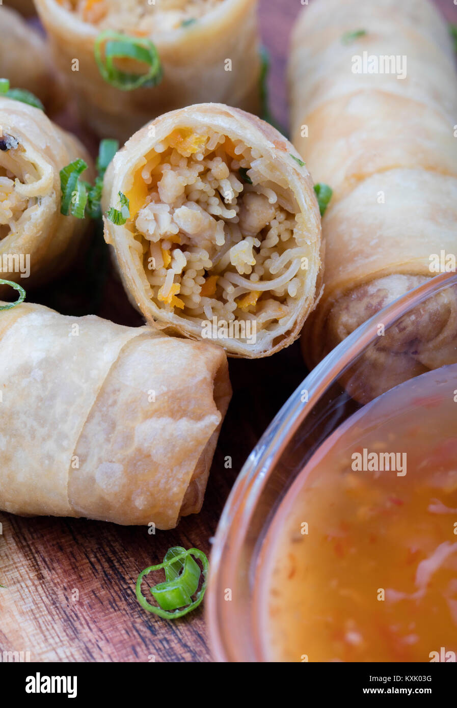 thai spring rolls with sauce and green vegetables Stock Photo - Alamy
