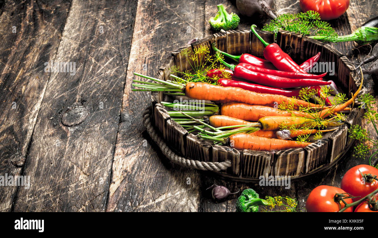 Organic food. Fresh harvest of vegetables. On a wooden background Stock ...
