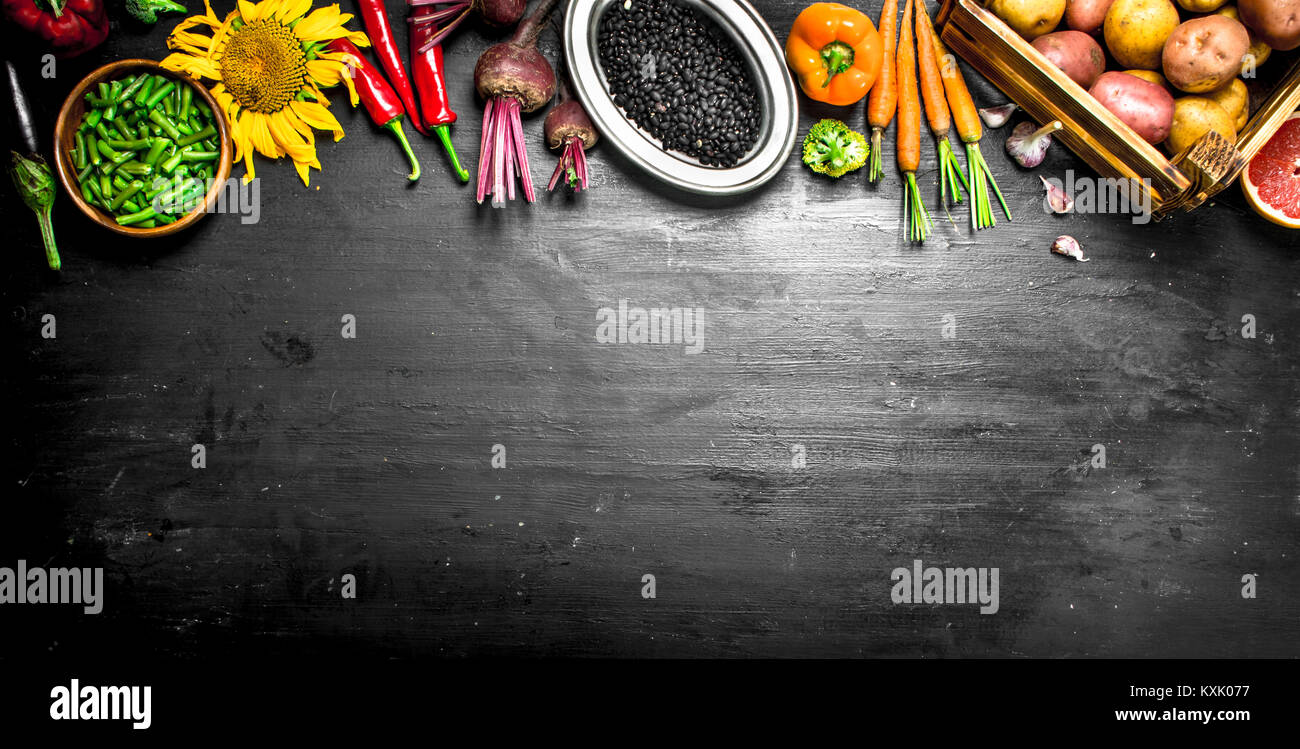 Organic food. Fresh harvest of vegetables and fruits. On the black ...