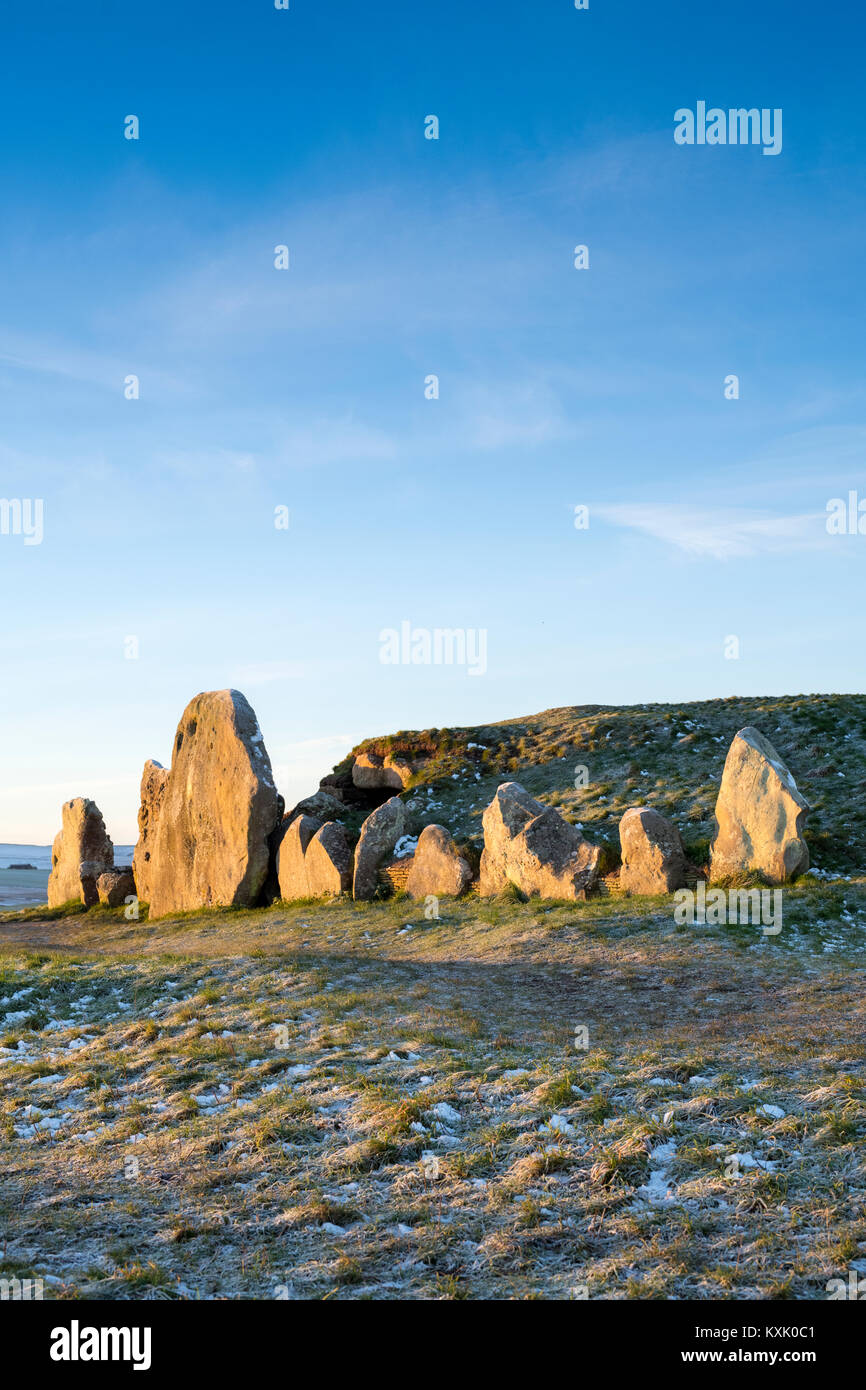 West Kennet Long Barrow in the winter at sunrise. Neolithic chambered ...