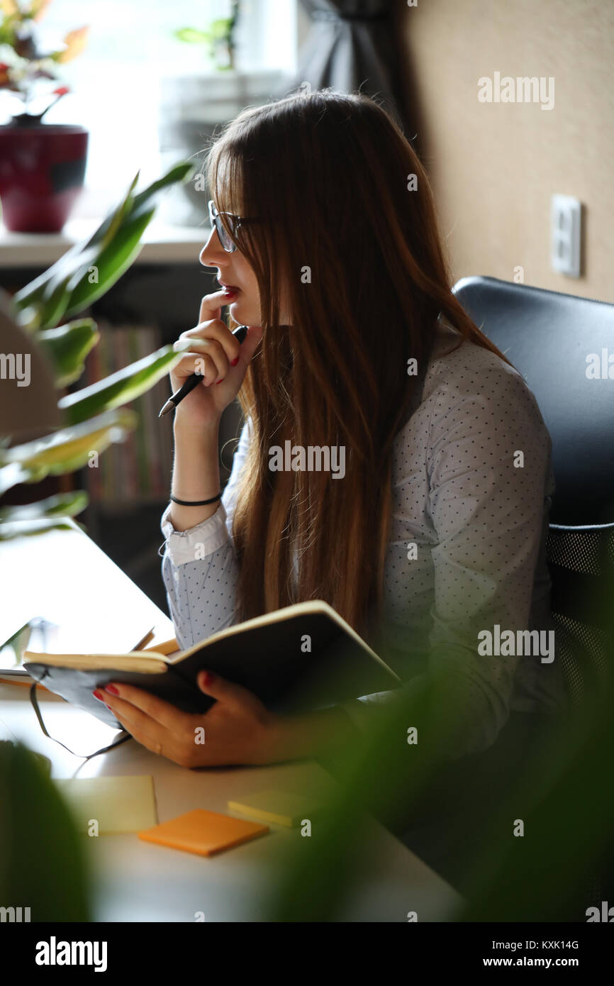 Daily routine. Woman in the office Stock Photo - Alamy