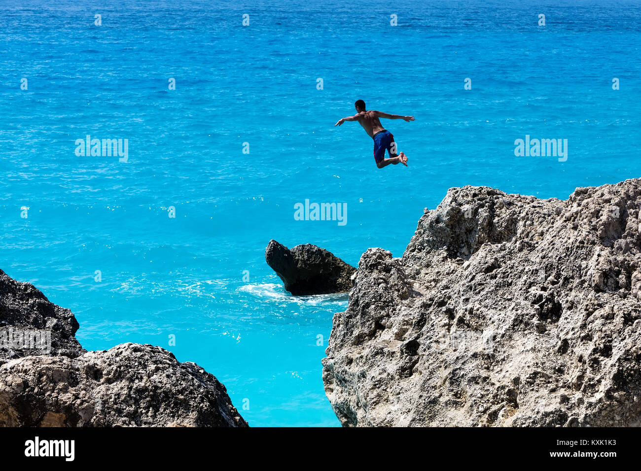 People to jump playing in the sea at the Kavalikefta Beach in Lefkada ...