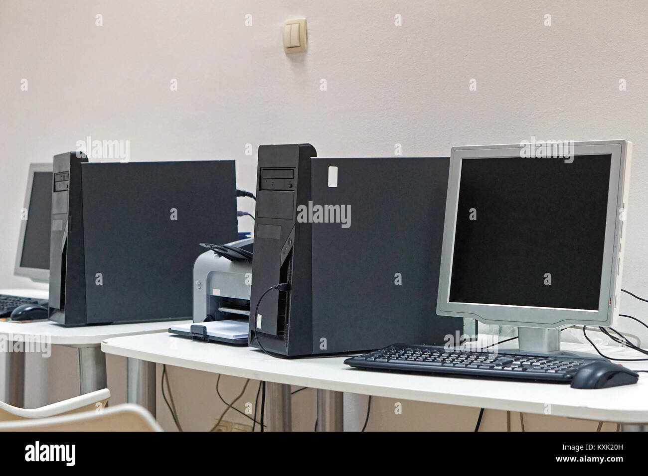 Desktop computers with lcd screen and printer Stock Photo - Alamy