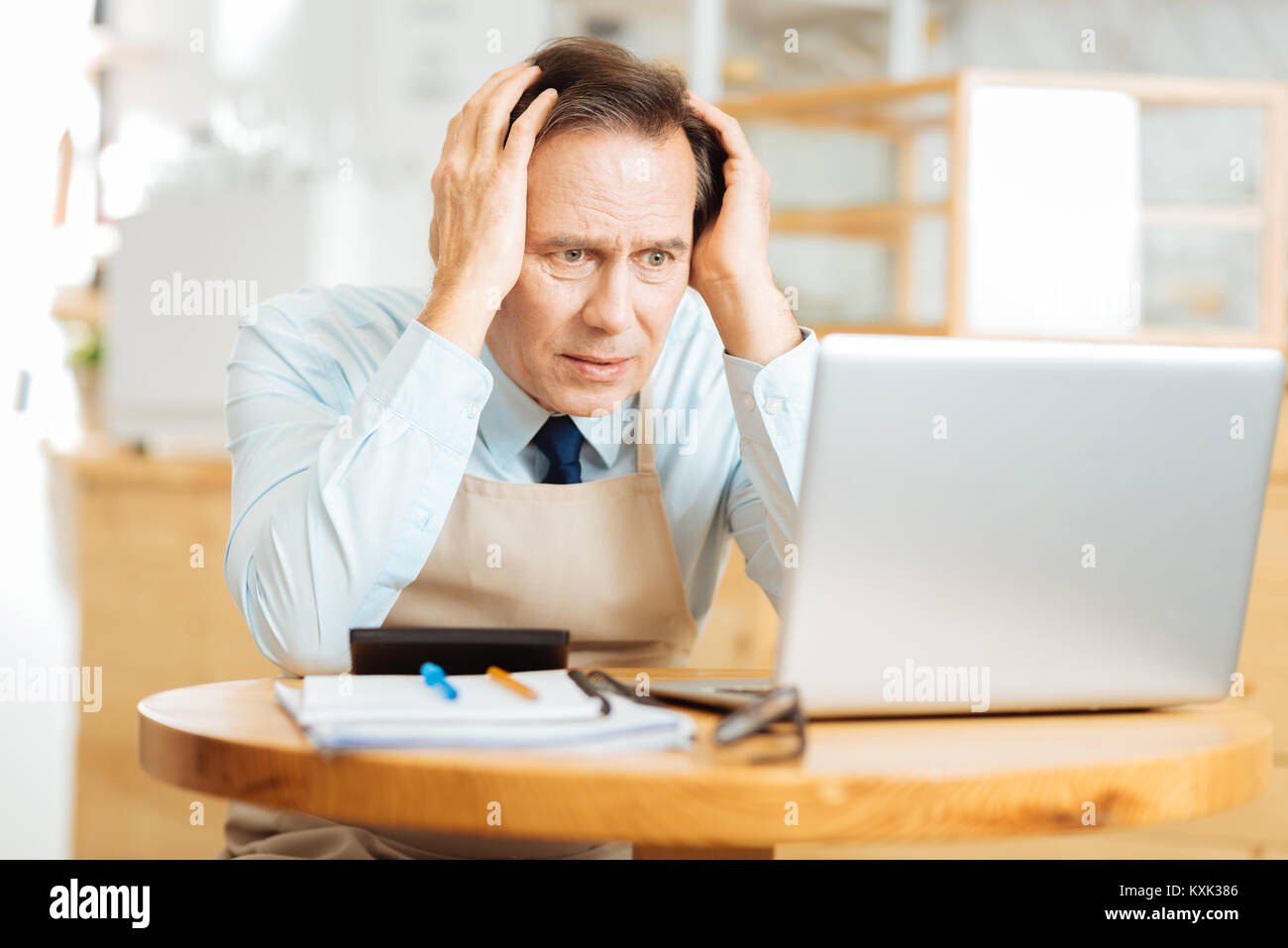 Stressed perplexed man sitting and thinking about business problems ...