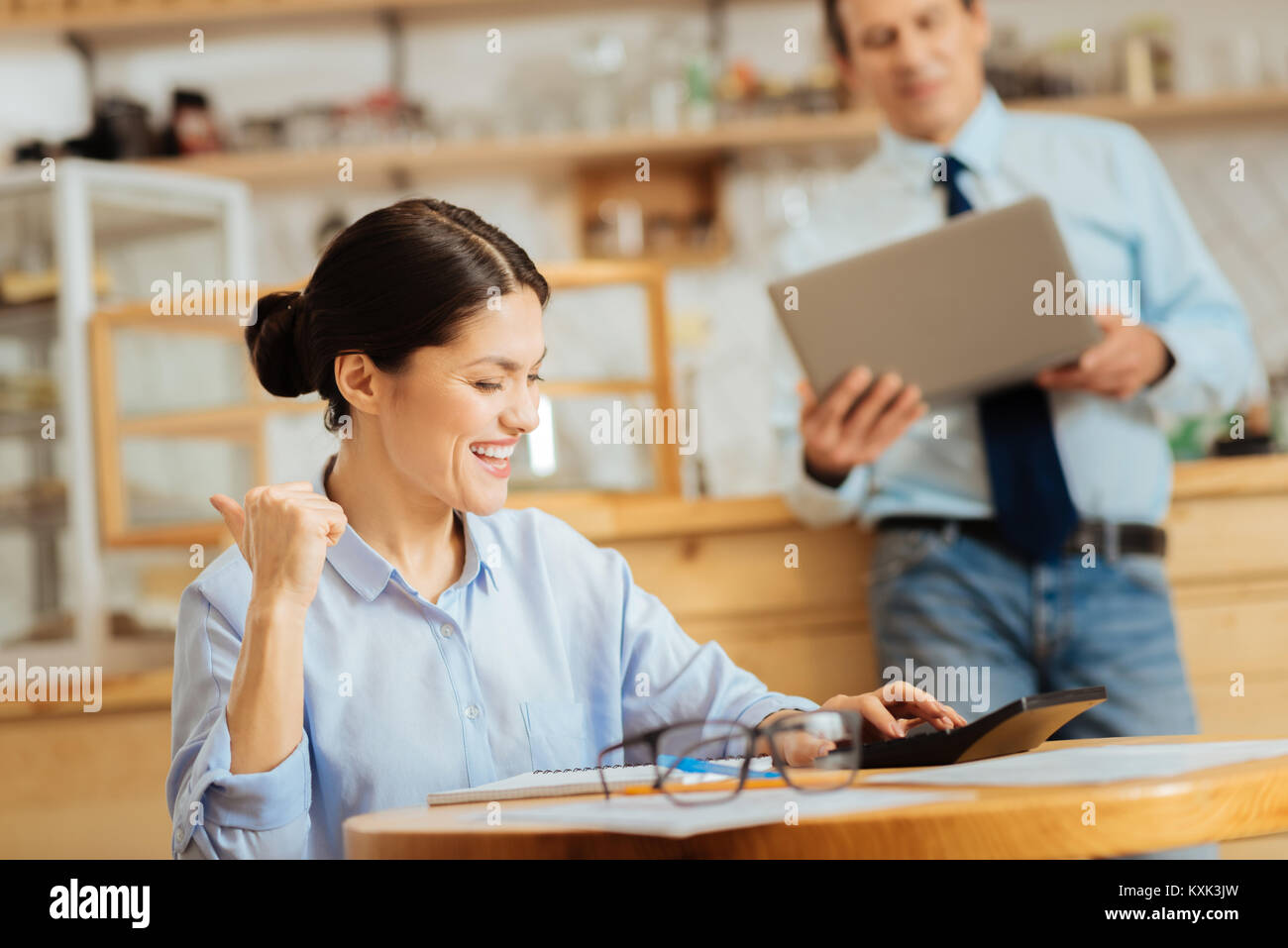 Funny cute woman calculating and laughing Stock Photo - Alamy