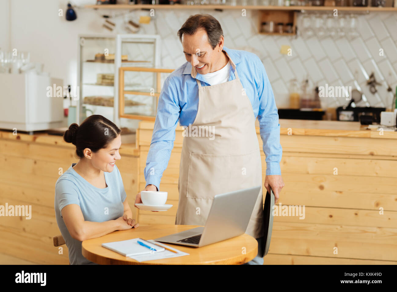 Joyful polite man standing hi-res stock photography and images - Alamy