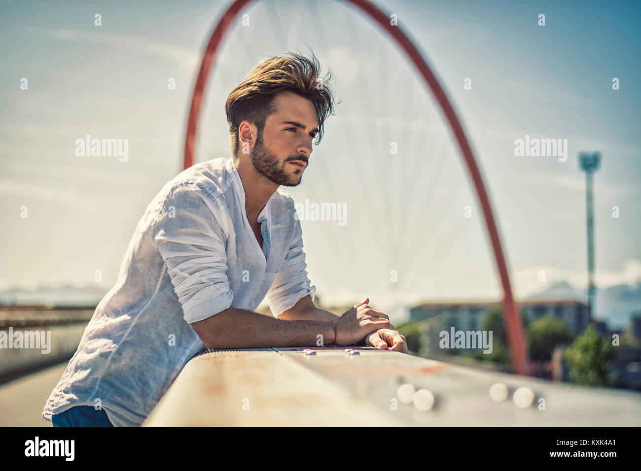 One handsome young man in city setting Stock Photo - Alamy