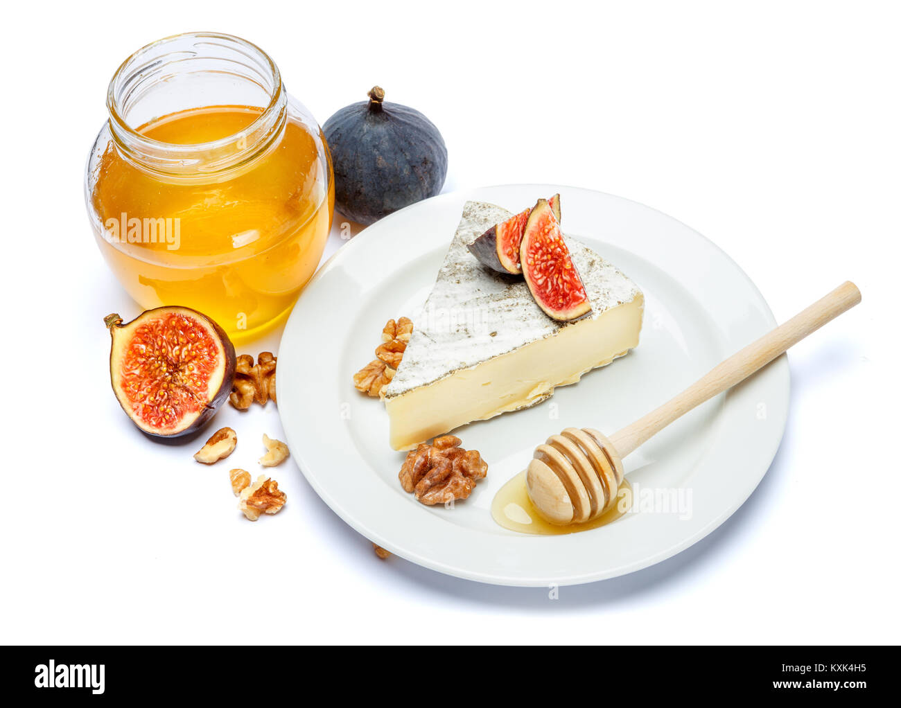 traditional french brie cheese and honey on a white background Stock ...