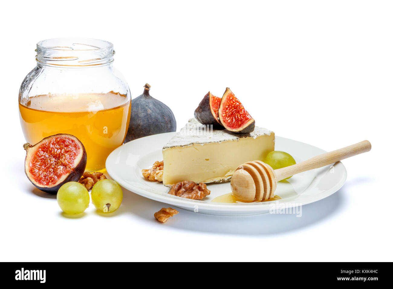 traditional french brie cheese and honey on a white background Stock ...