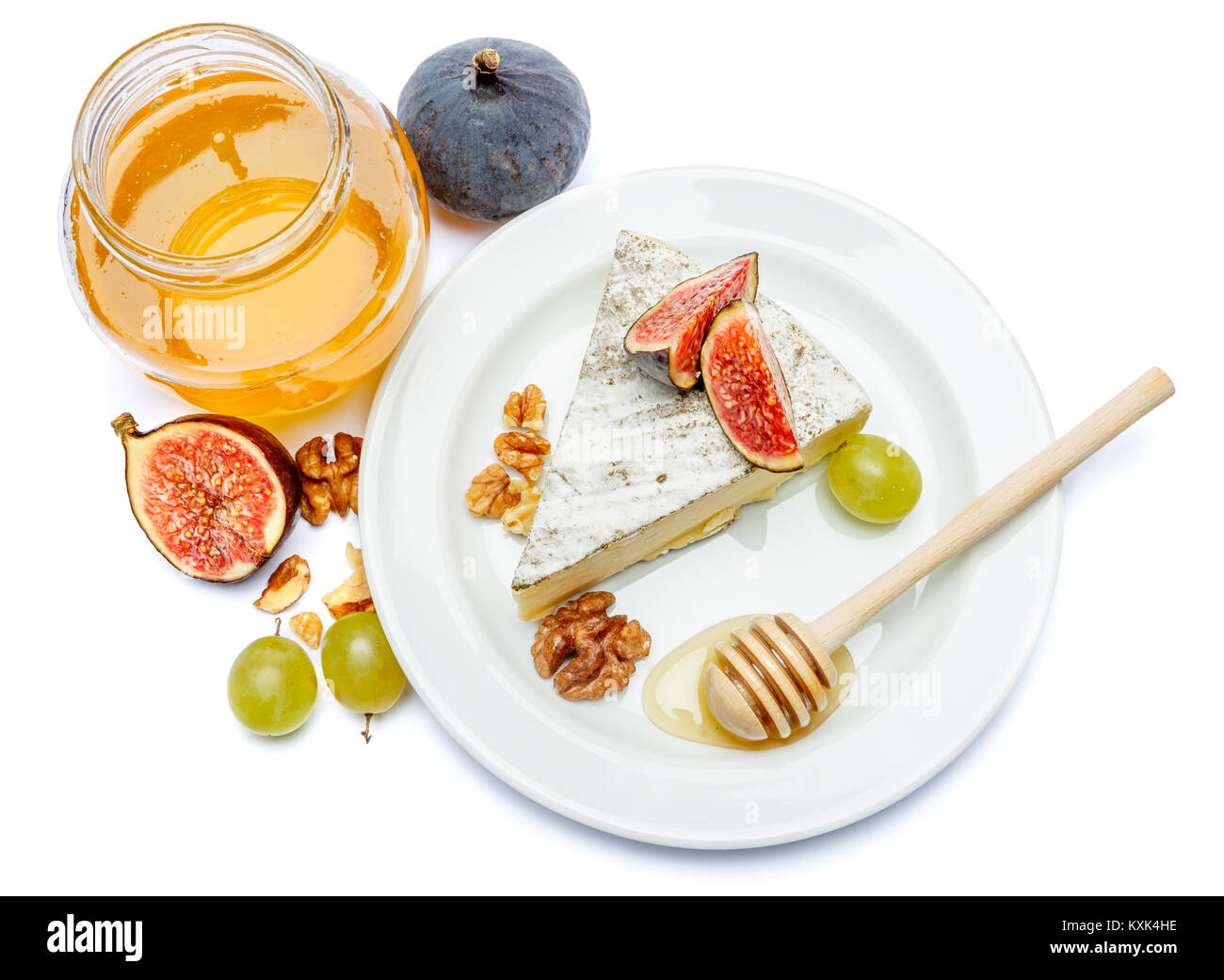 traditional french brie cheese and honey on a white background Stock ...