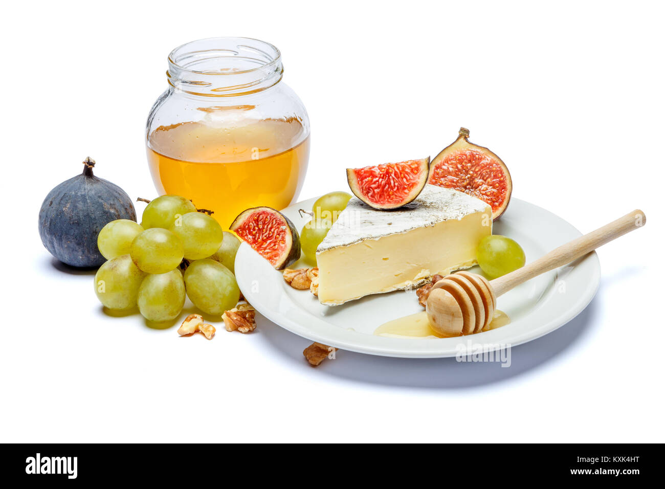 traditional french brie cheese and honey on a white background Stock ...