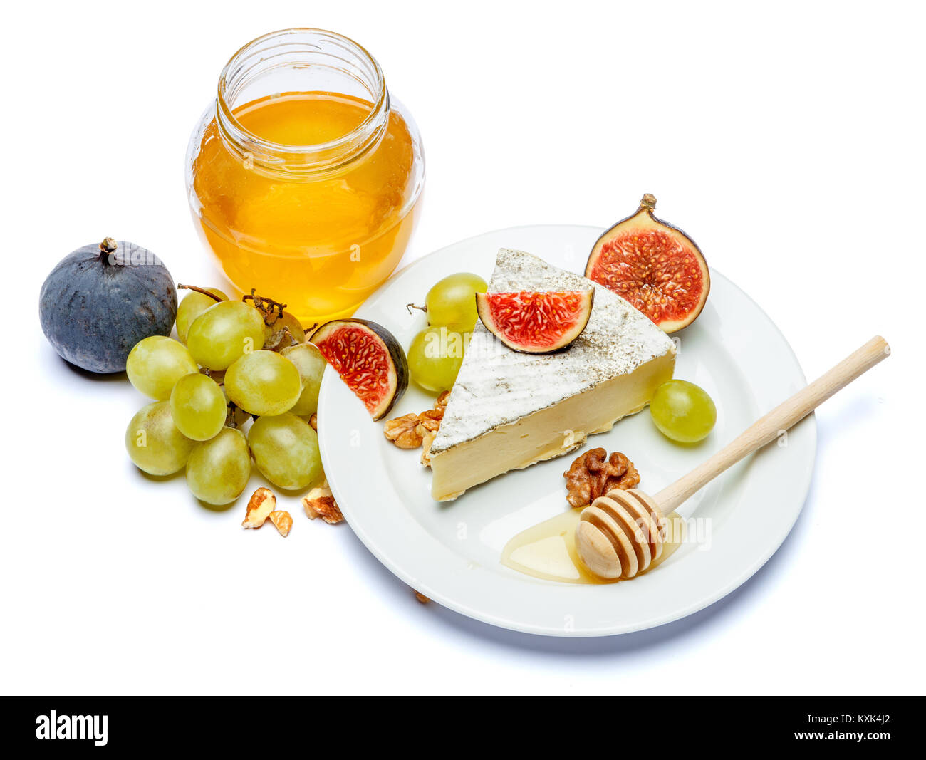 traditional french brie cheese and honey on a white background Stock ...