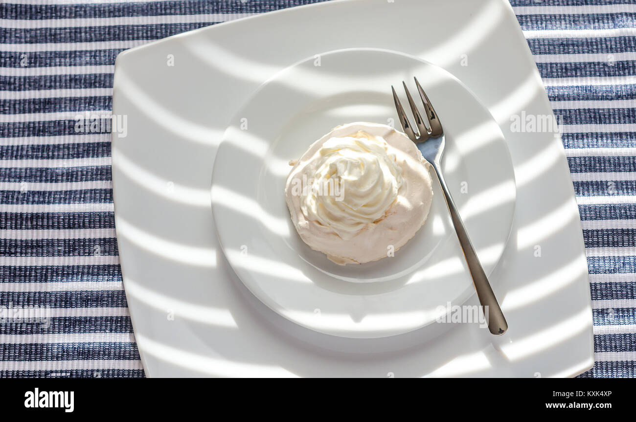 Meringue cake with whipped cream and berry topping Stock Photo - Alamy
