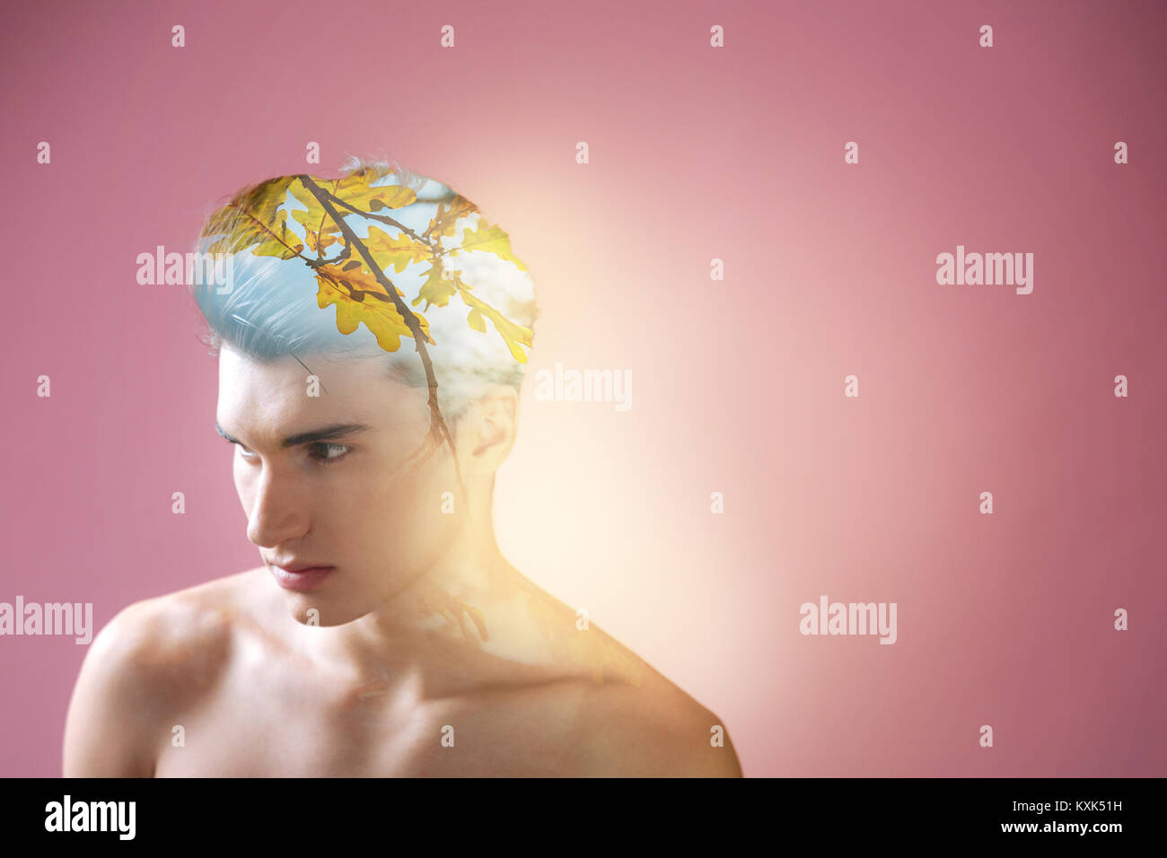 Nice creative man imagining a tree branch Stock Photo - Alamy