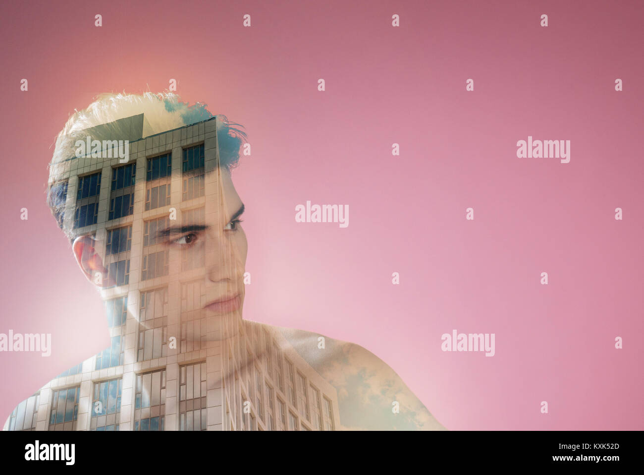 Nice young man imagining a building Stock Photo - Alamy