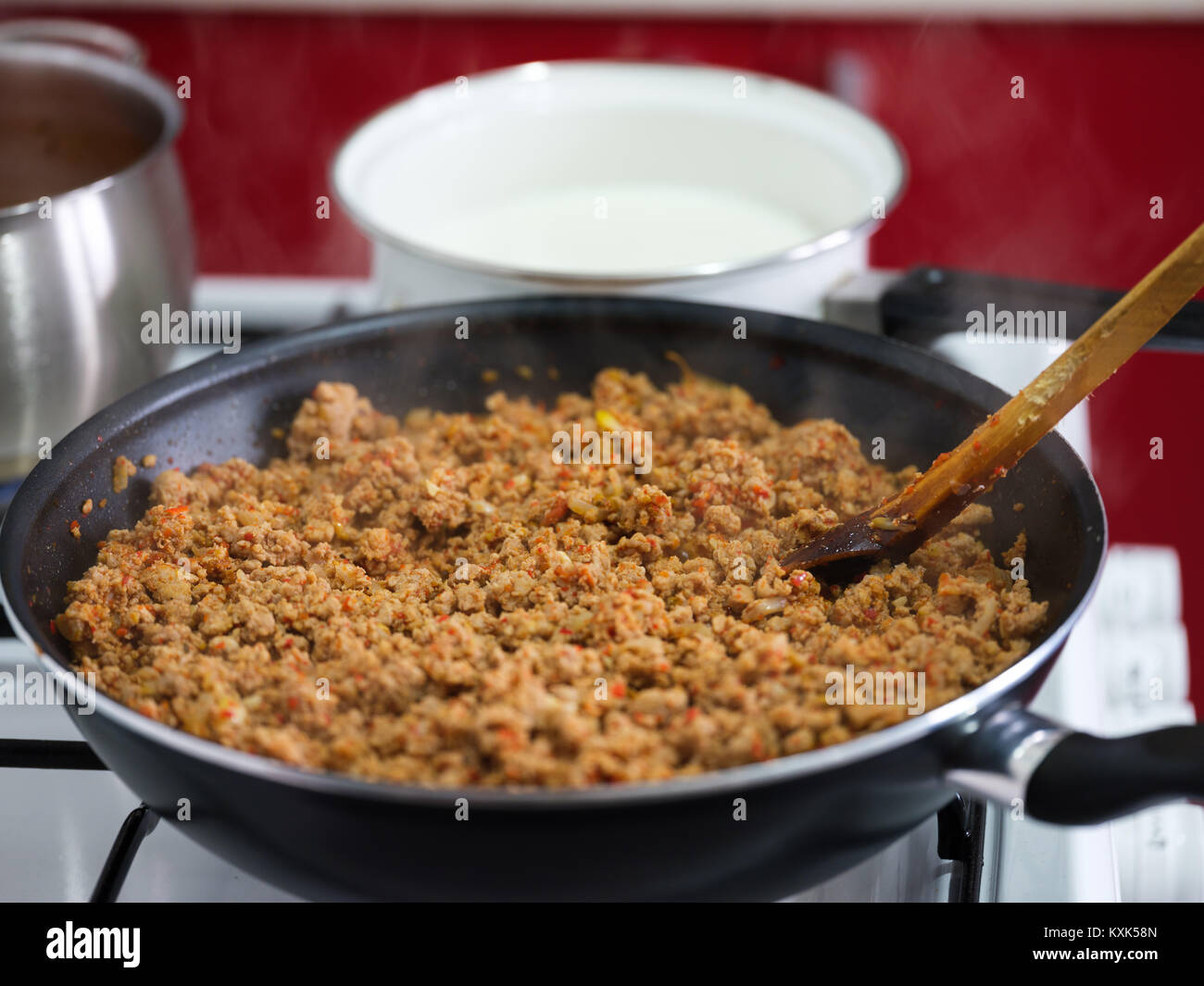 Minced beef and pork meat in the frying pan Stock Photo - Alamy