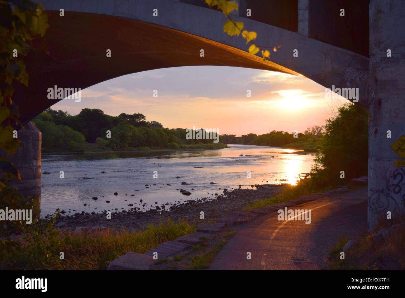 sunset through bridge Stock Photo - Alamy