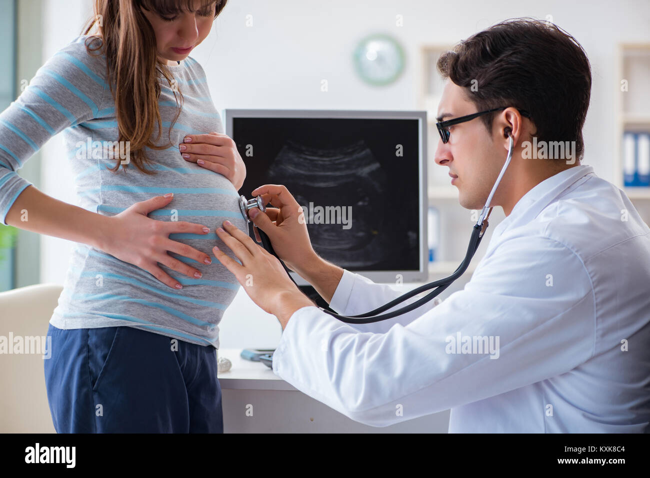 Pregnant woman visiting doctor for regular check-up Stock Photo - Alamy
