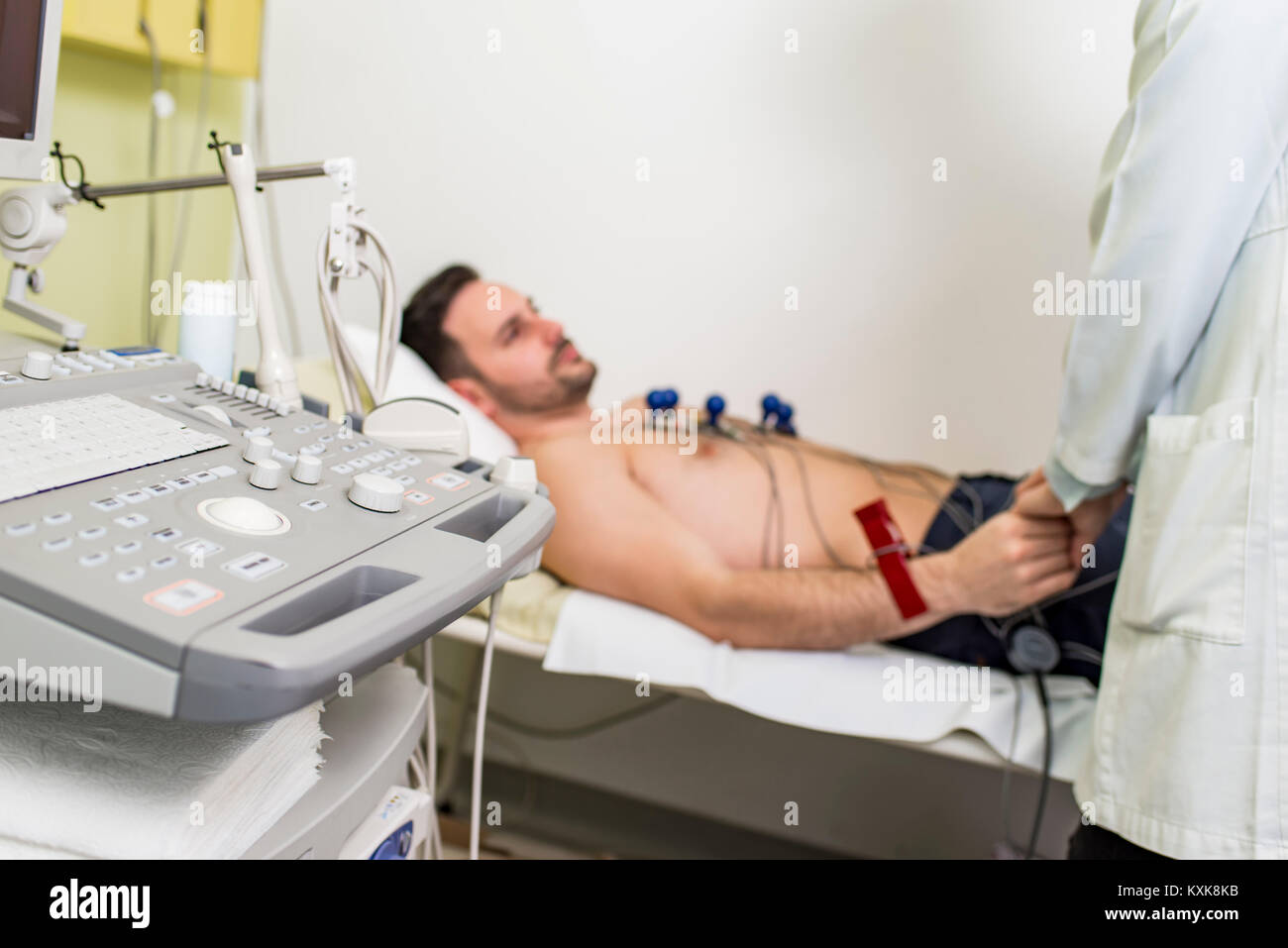 Young man doing preventive EKG in hospital Stock Photo - Alamy