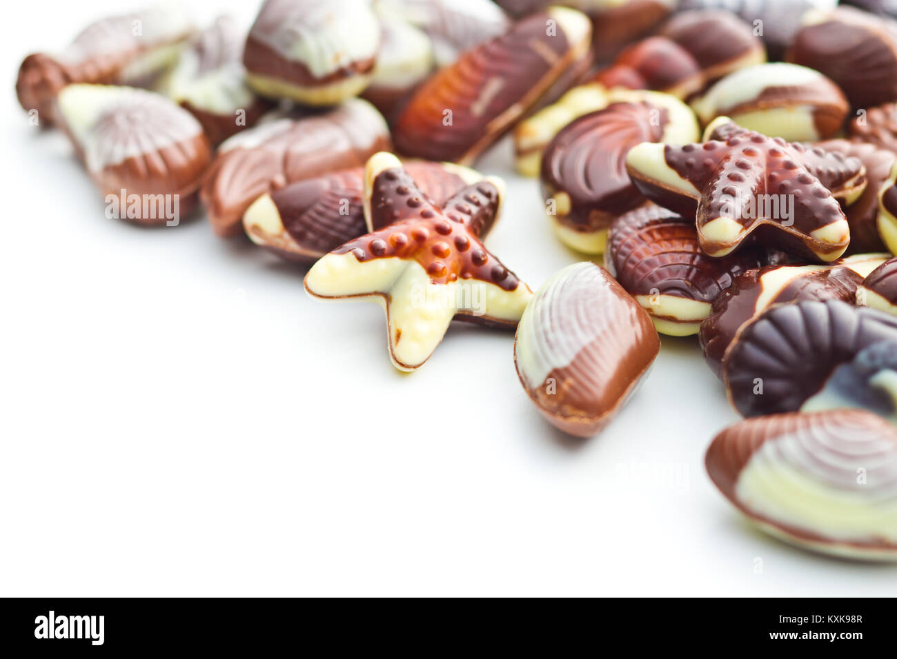 Sweet chocolate seashells isolated on white background Stock Photo - Alamy