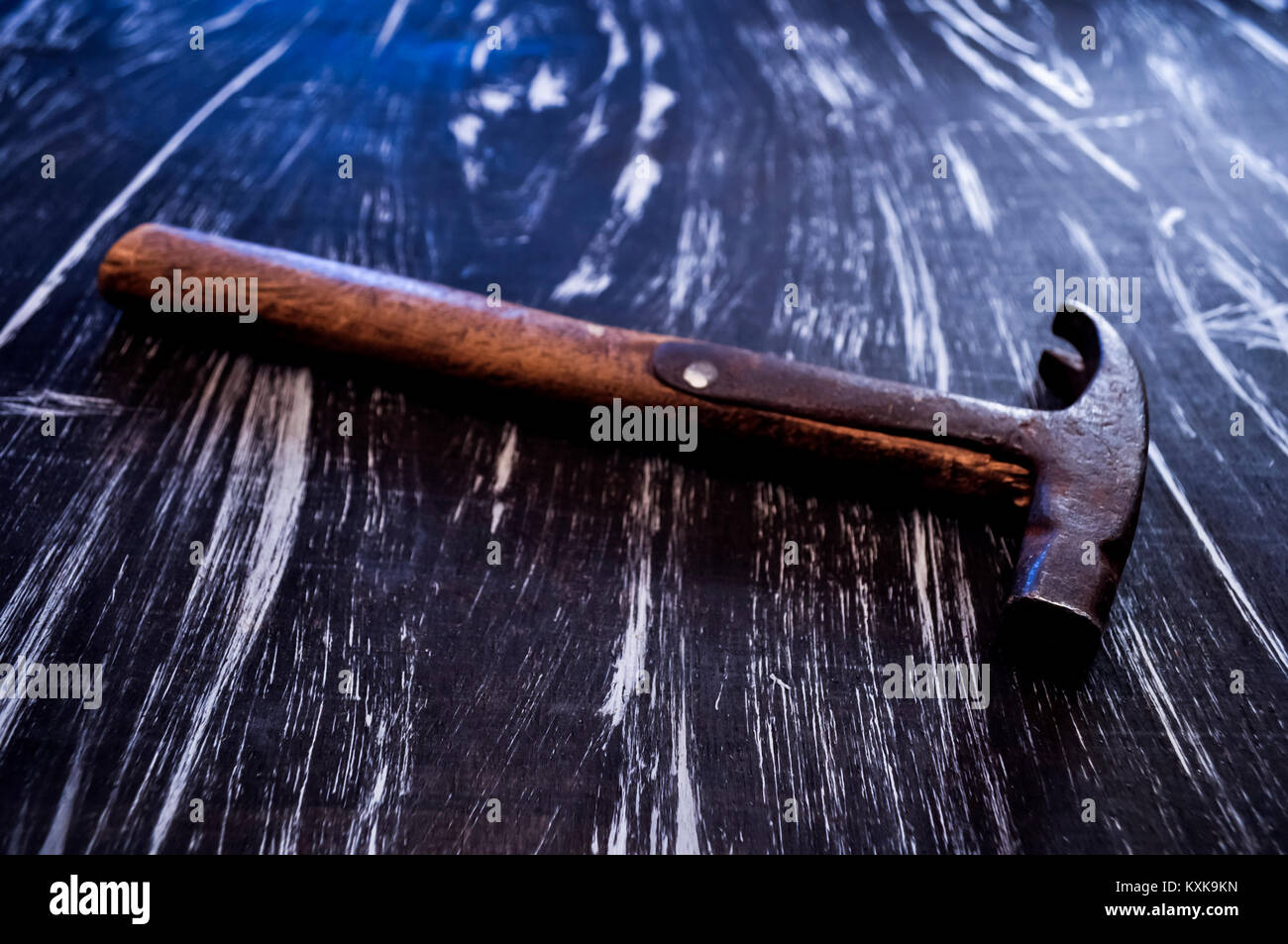 Hammer to repair lying on a wooden table. Men's housework. Worki Stock ...
