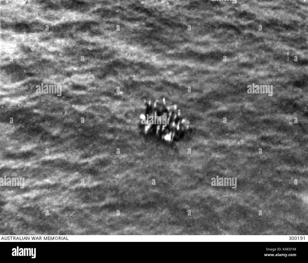 A historical photograph depicting survivors from HMAS Armidale, an ...