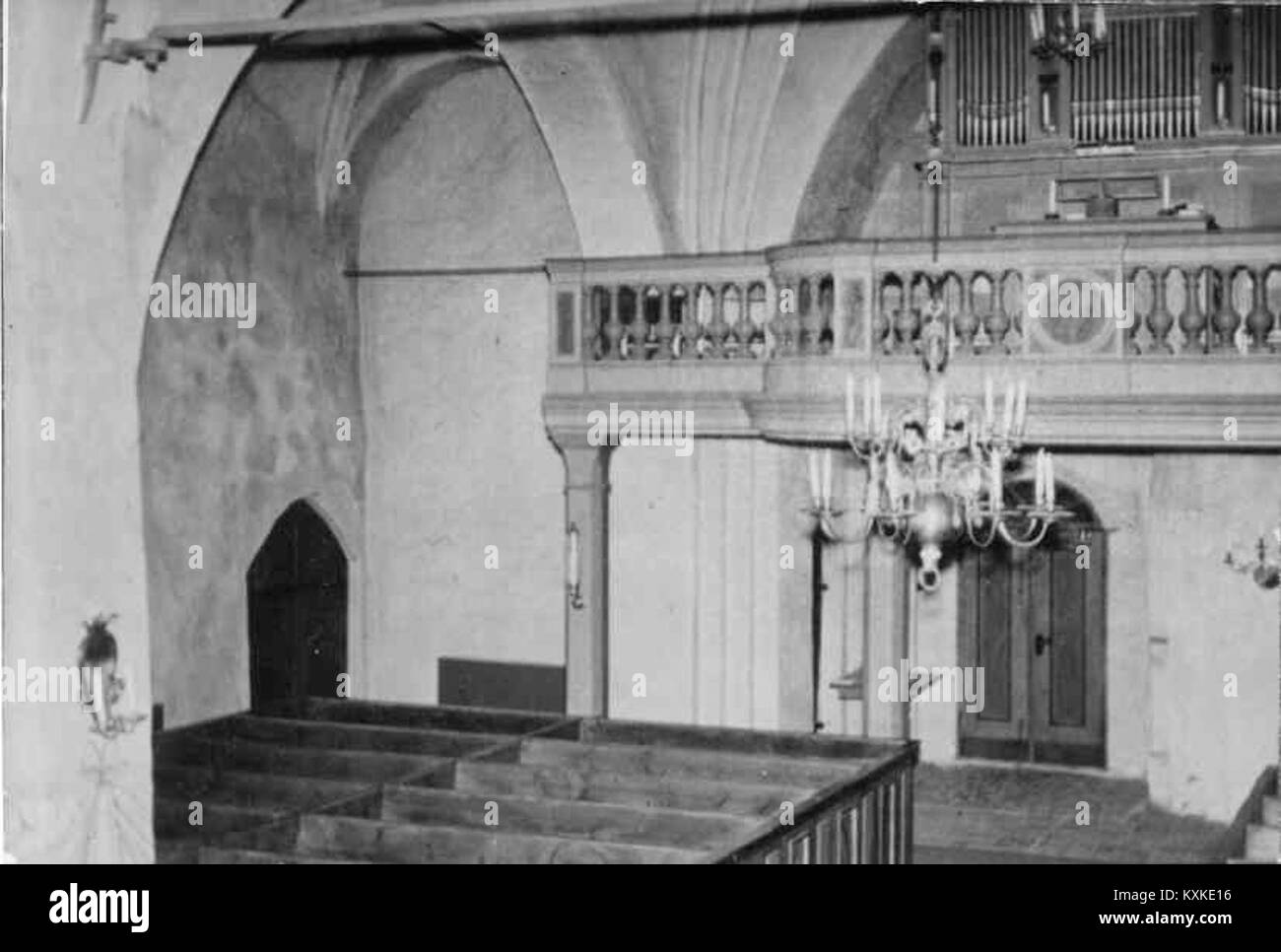A detailed interior view of Aspö Church shows the altar, nave, and ...