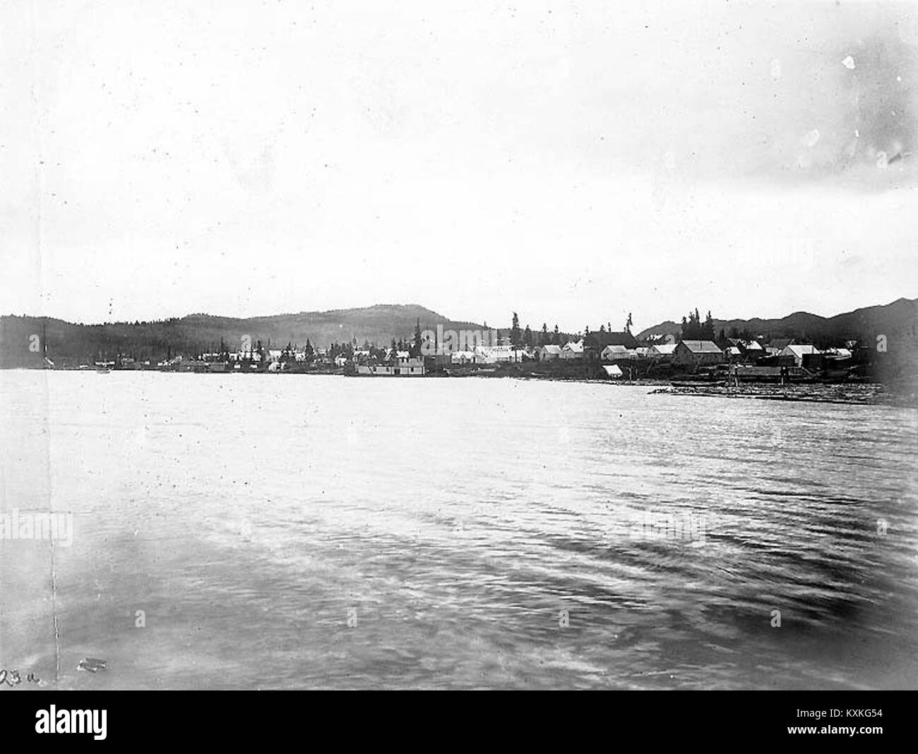 A scenic view of Atlin, British Columbia, from the water around 1898 ...
