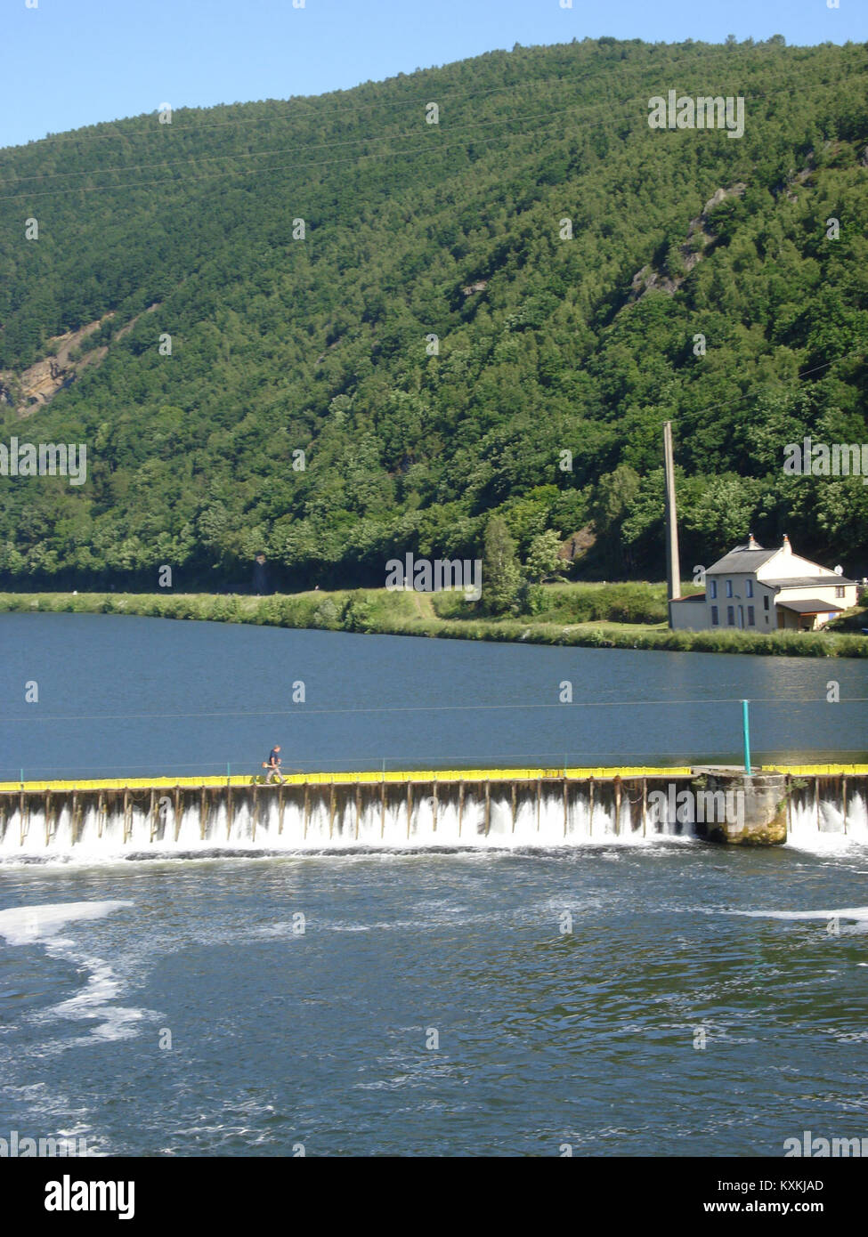 A photograph of the lock barrage near Revin, France, showing the canal ...