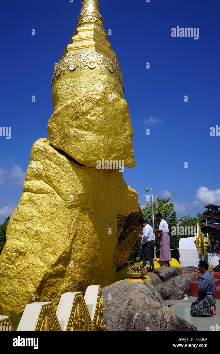 MAWLAMYINE, MYANMAR - CIRCA APRIL 2017 People with golden petals in Nwa ...