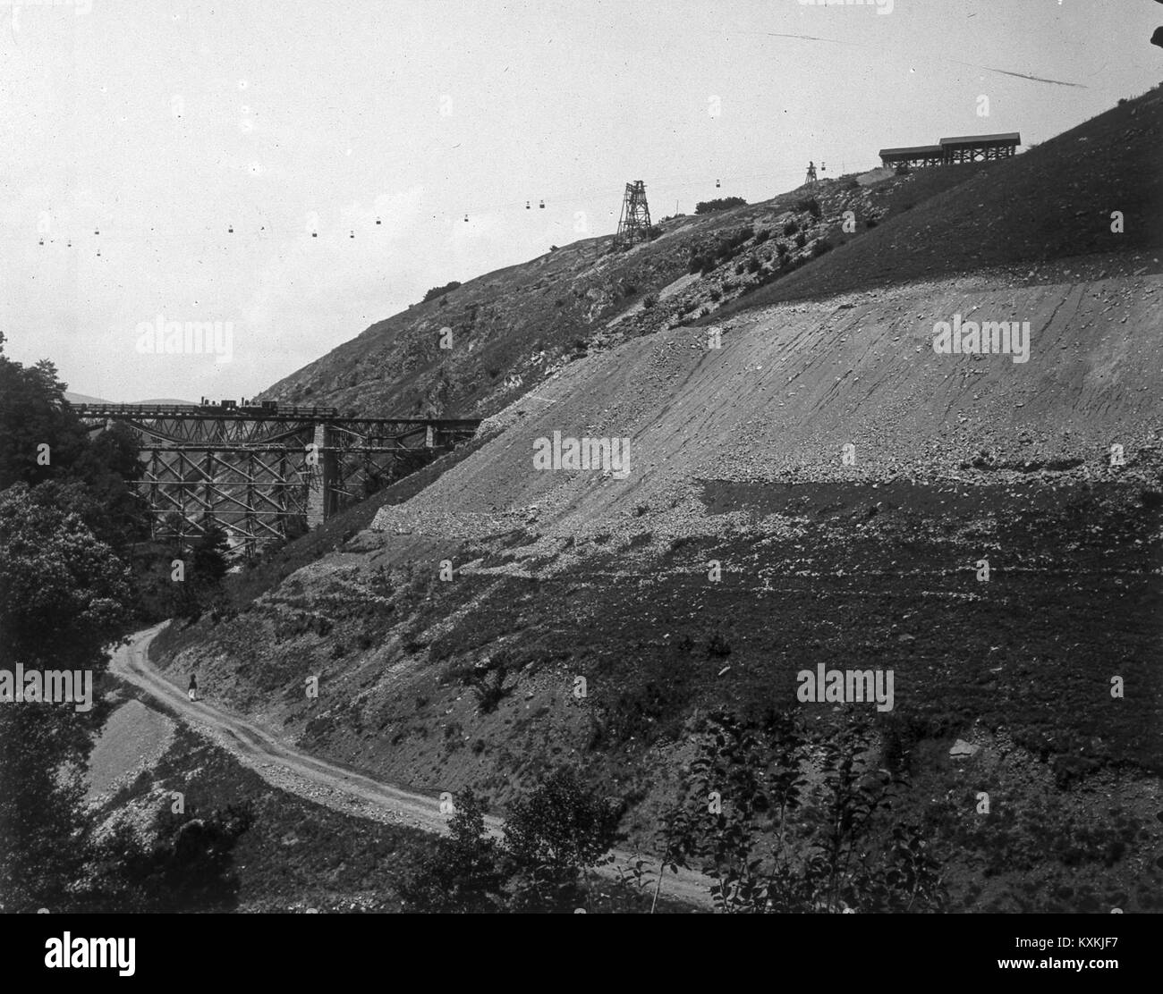 This image shows a mining railway bridge crossing a valley and a ...