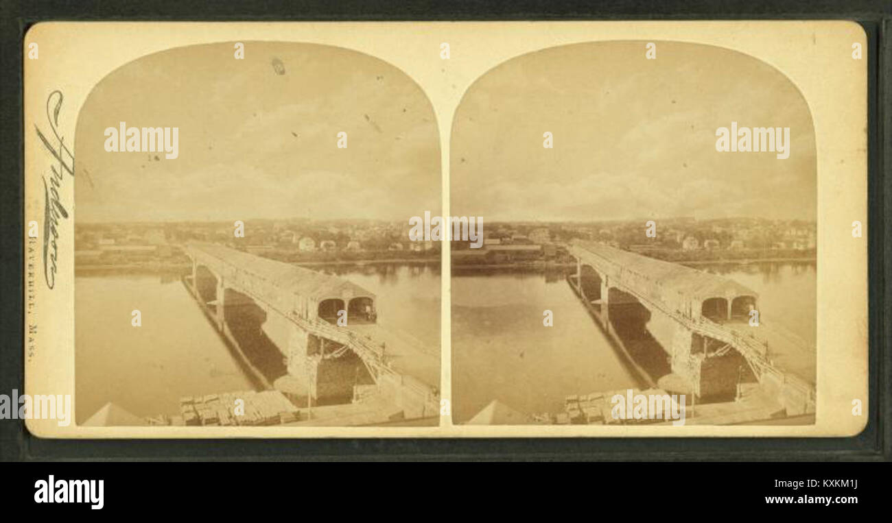 A photograph of a long covered bridge over the Merrimack River, taken ...