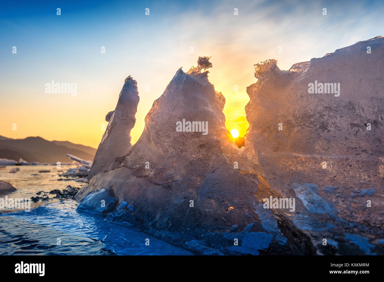Very large and beautiful chunk of Ice at Sunrise in winter Stock Photo ...