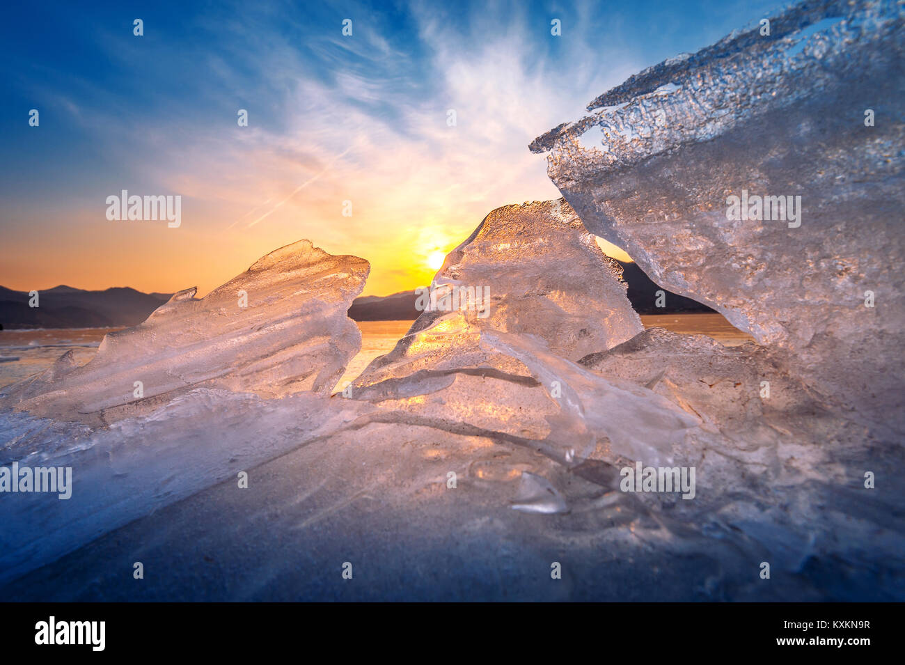 Very large and beautiful chunk of Ice at Sunrise in winter Stock Photo ...