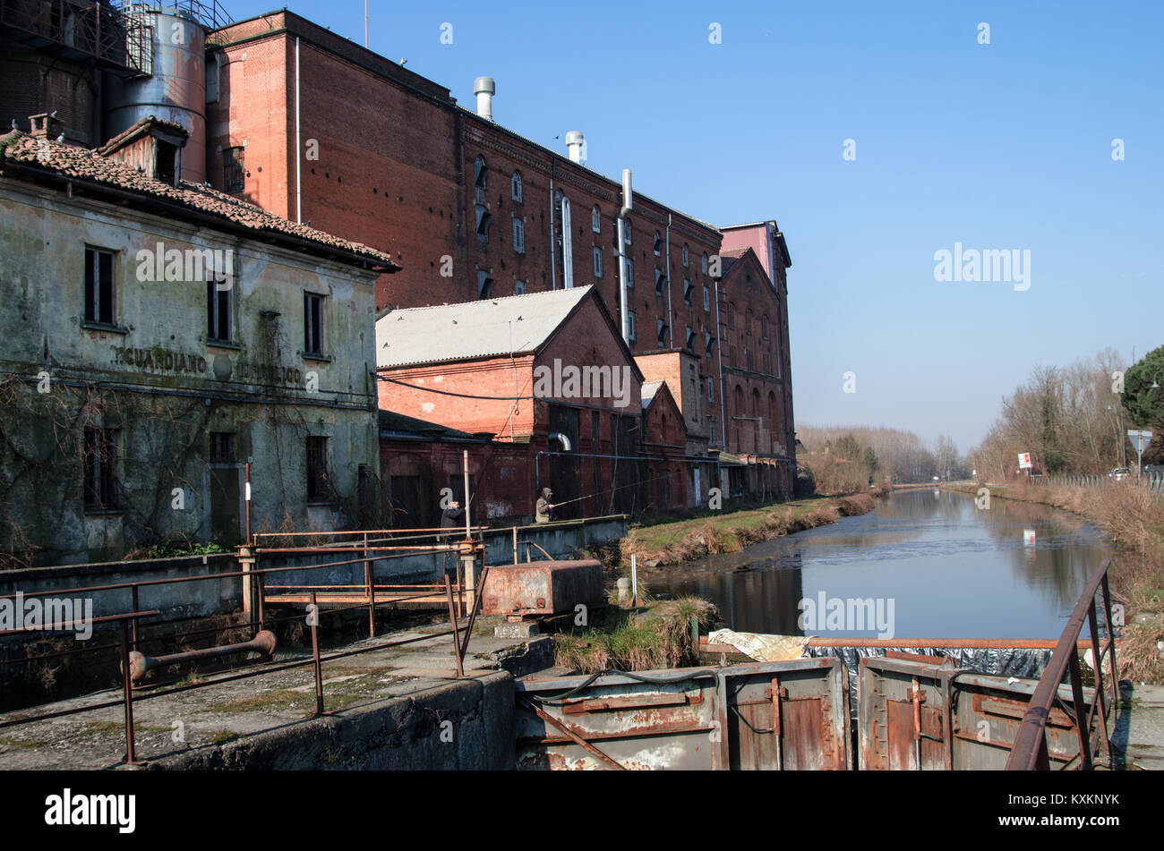 old industrial buildings along the Naviglio Pavese, canal between Milan ...