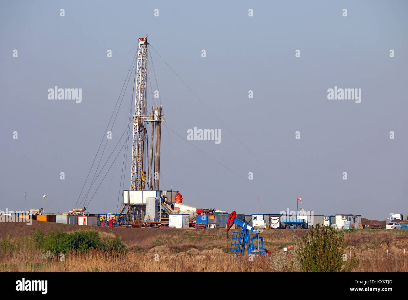 pump jack and oil drilling rig on oilfield Stock Photo - Alamy