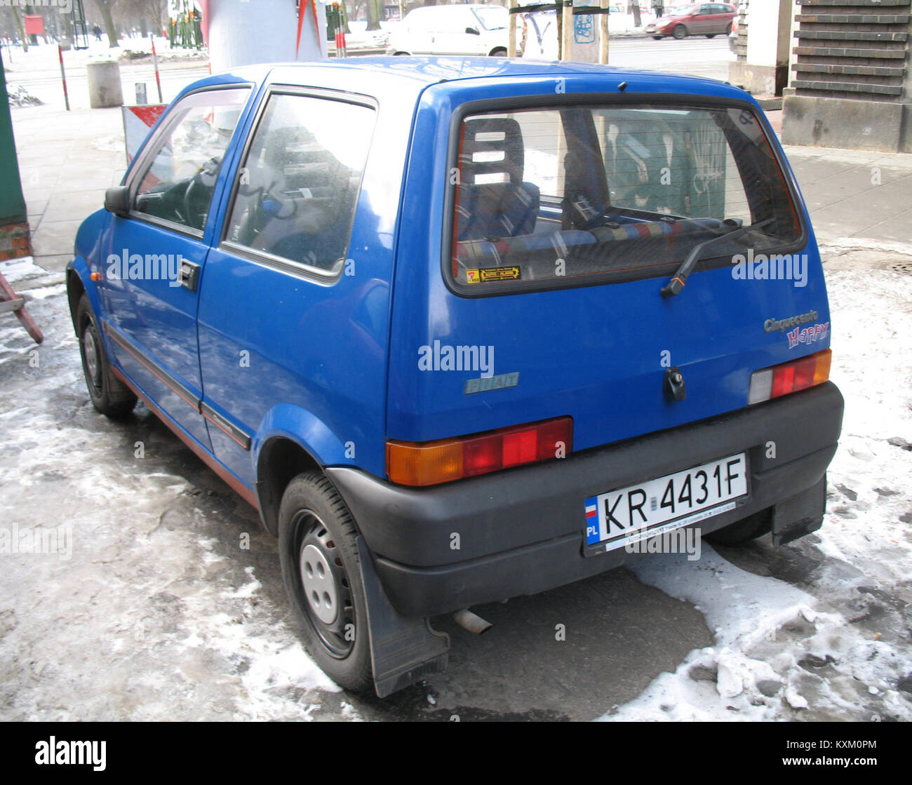 A blue Fiat Cinquecento Happy car is parked in Kraków, Poland ...