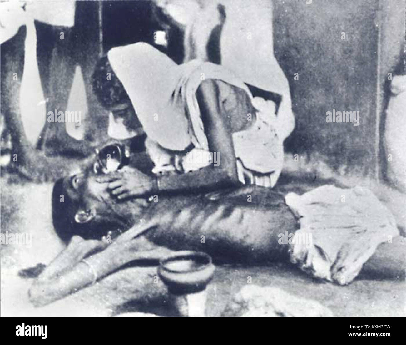 The photograph shows a woman during the 1943 Bengal famine ...