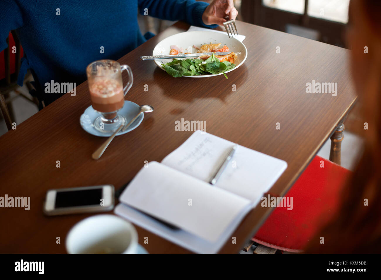Cropped view of customer dining in cafe Stock Photo - Alamy