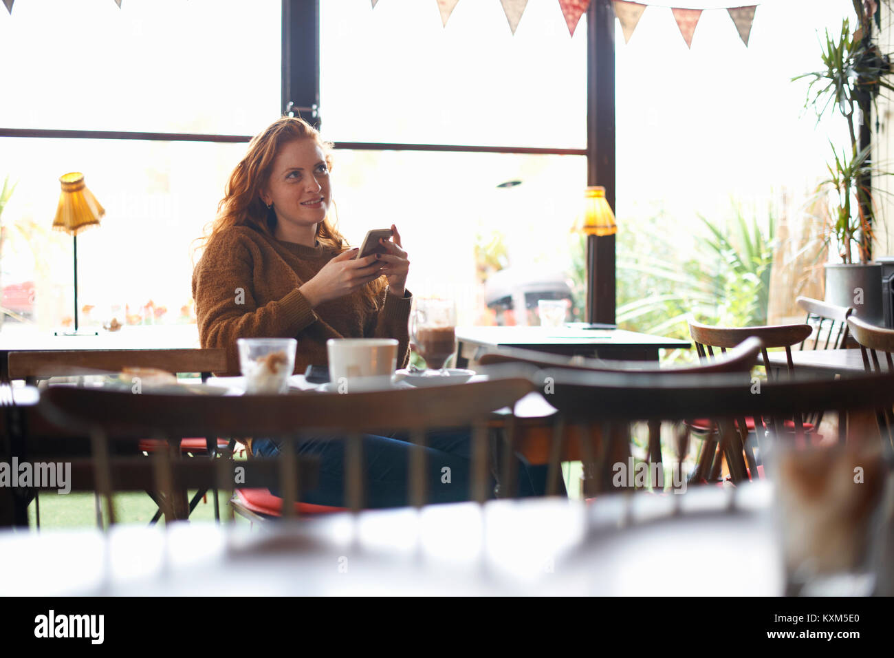 Woman cafe cell hi-res stock photography and images - Alamy